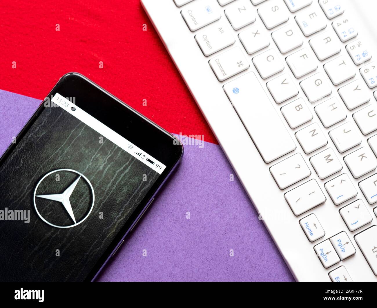 In this photo illustration the Mercedes Benz logo is seen displayed on ...