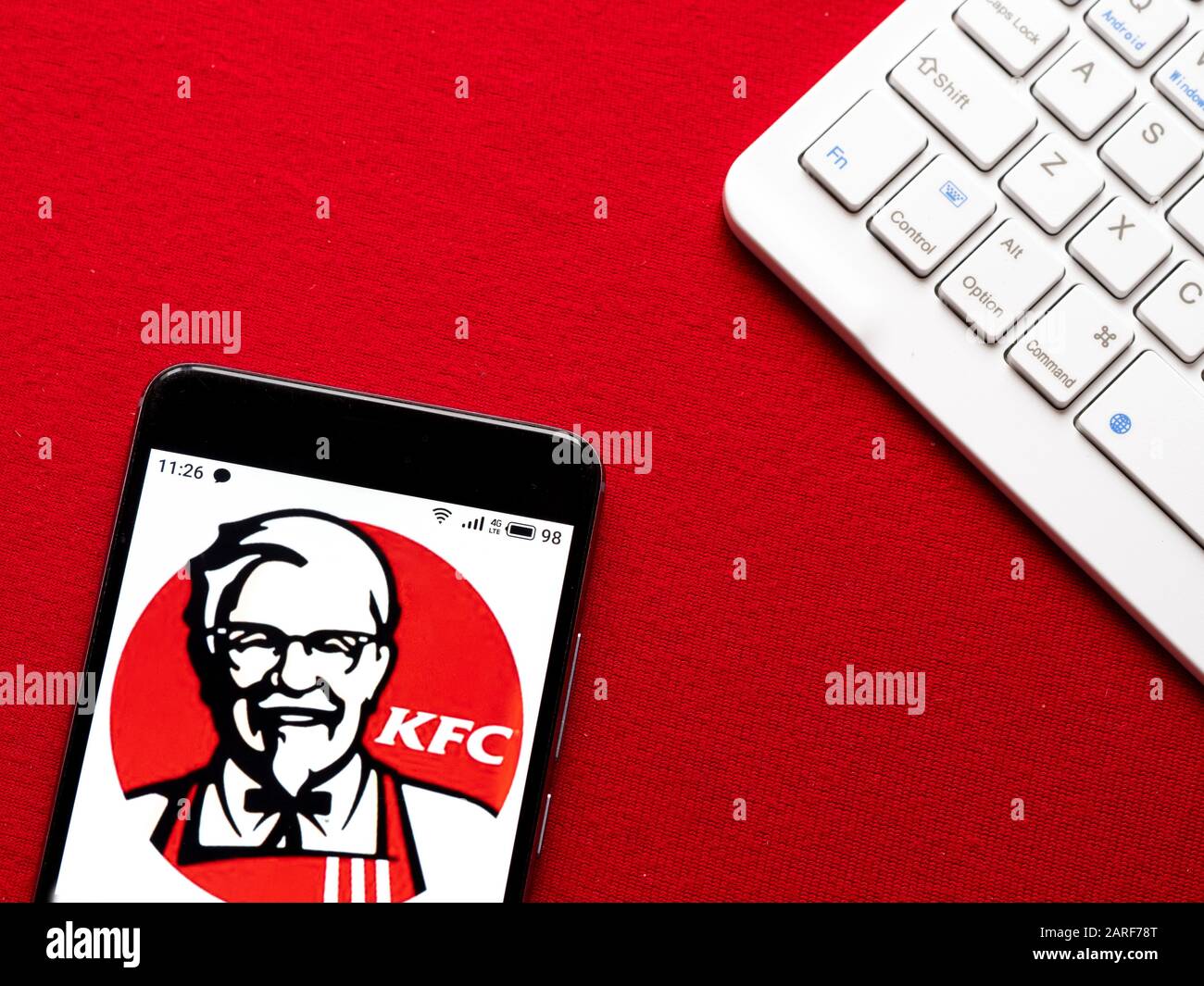 In this photo illustration the KFC logo is seen displayed on a ...