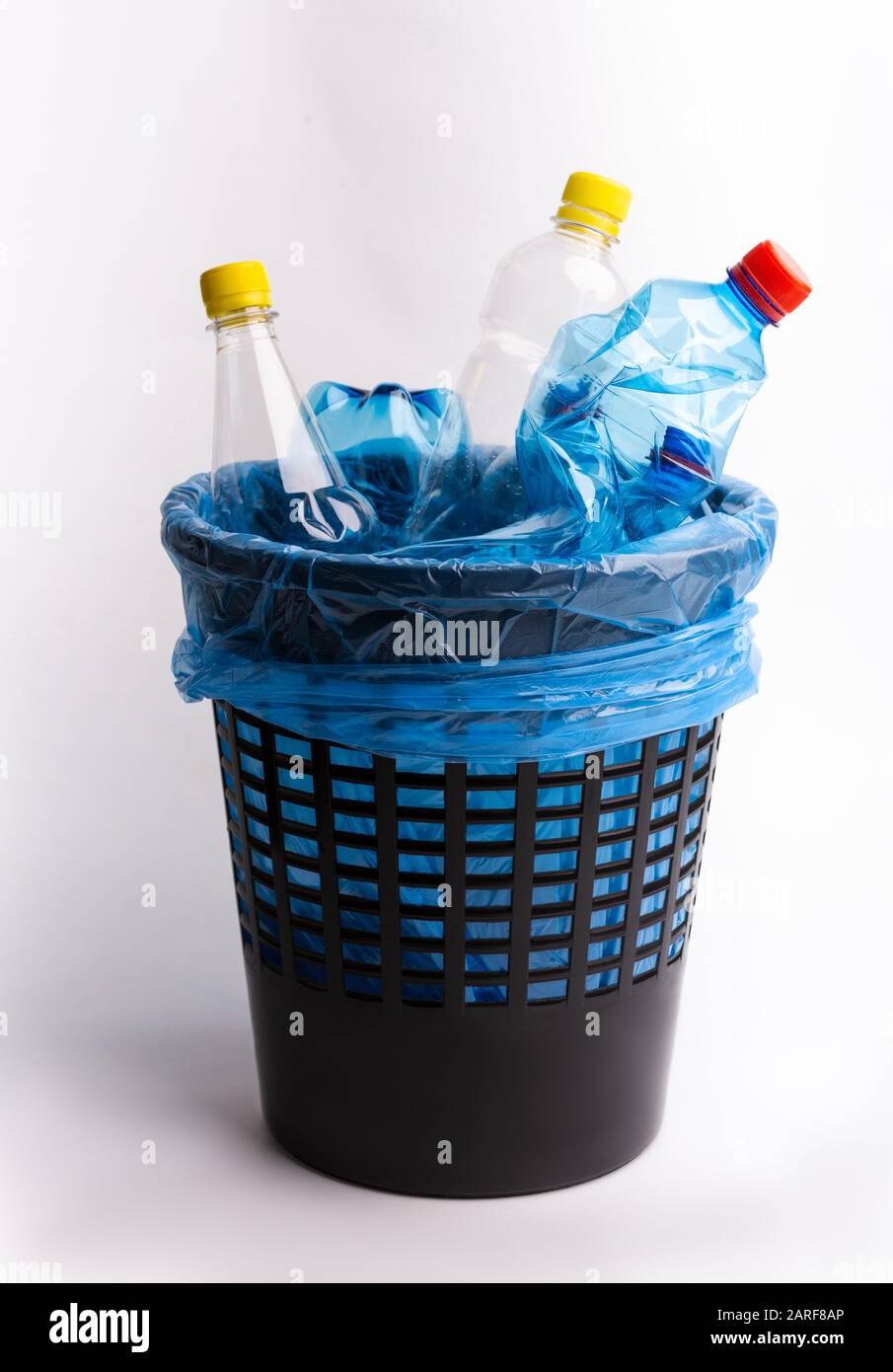 Food plastic packaging in trash can on white background Stock Photo - Alamy