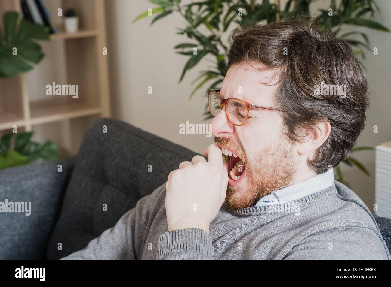 Tired person sofa hi-res stock photography and images - Alamy