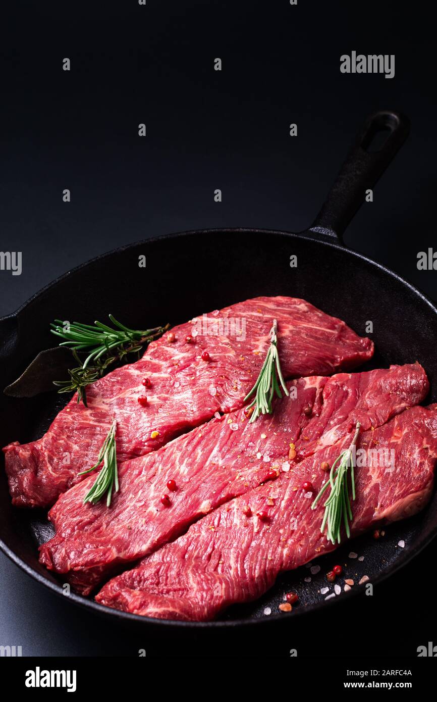 Food concept organic raw meat filet beef steak in skillet iron pan on ...