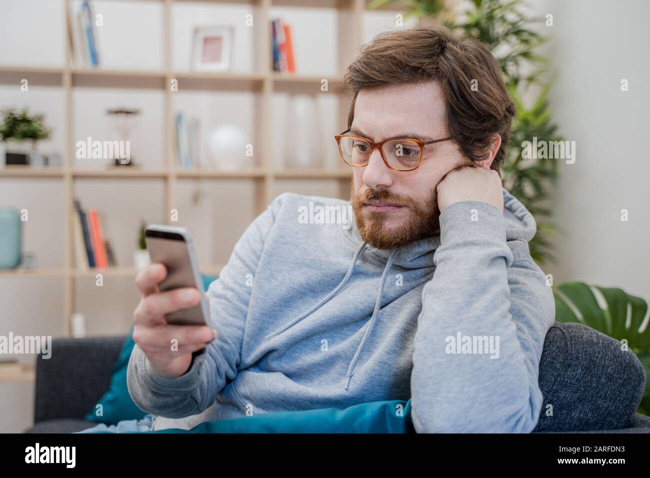 Man checking his phone hi-res stock photography and images - Alamy
