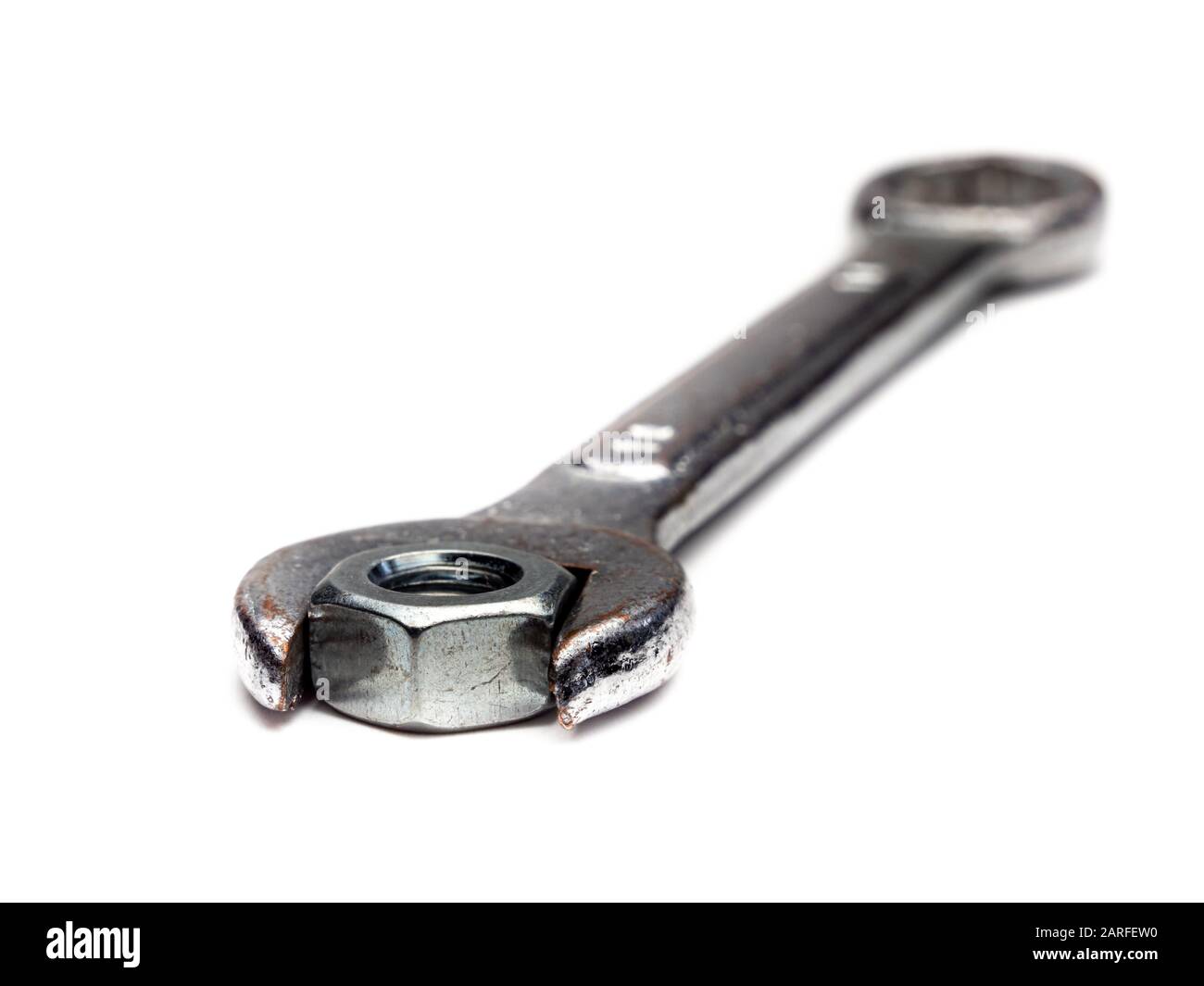 Wrench with nut isolated background texture Stock Photo - Alamy