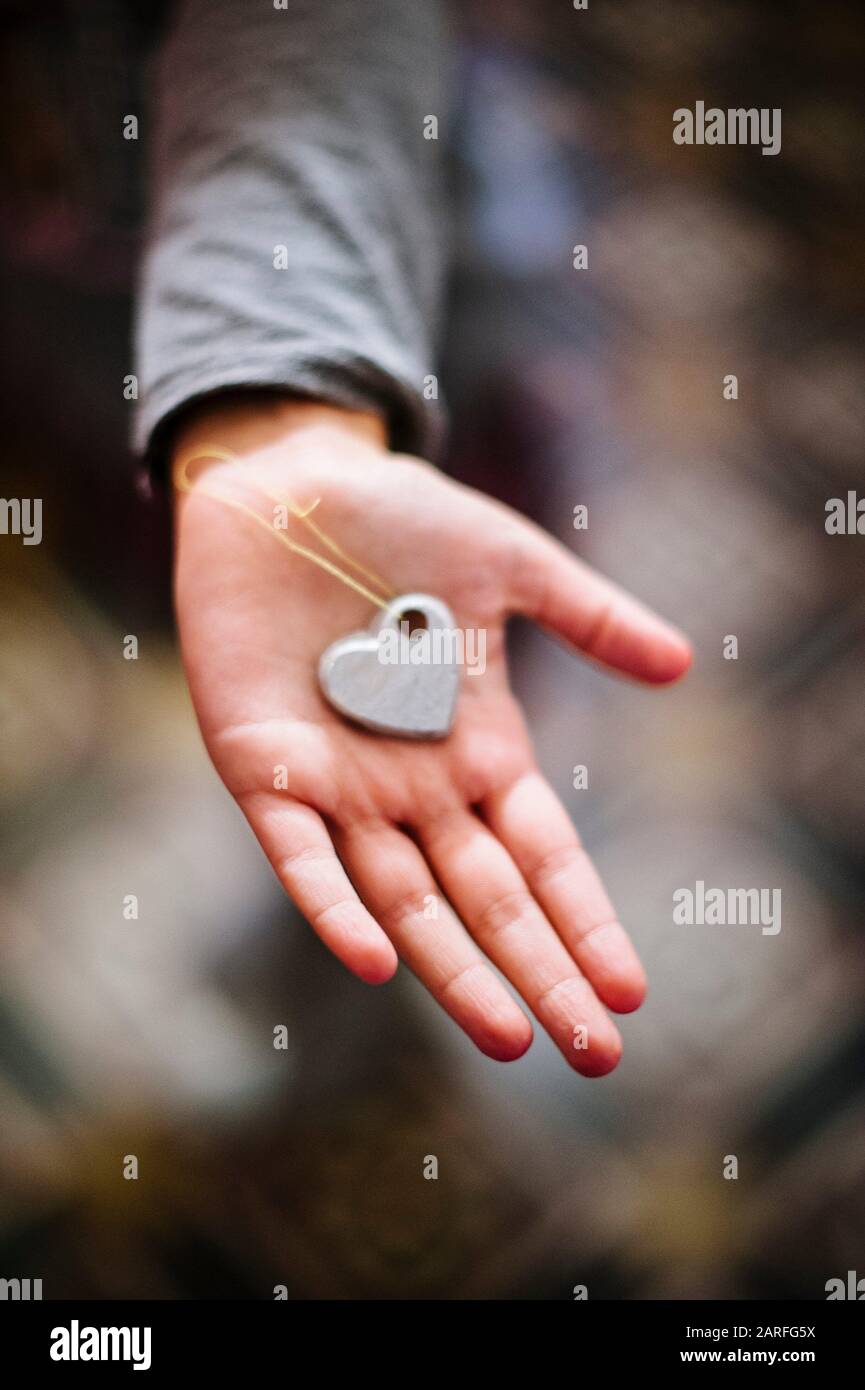 Hand holding pendulum hi-res stock photography and images - Alamy