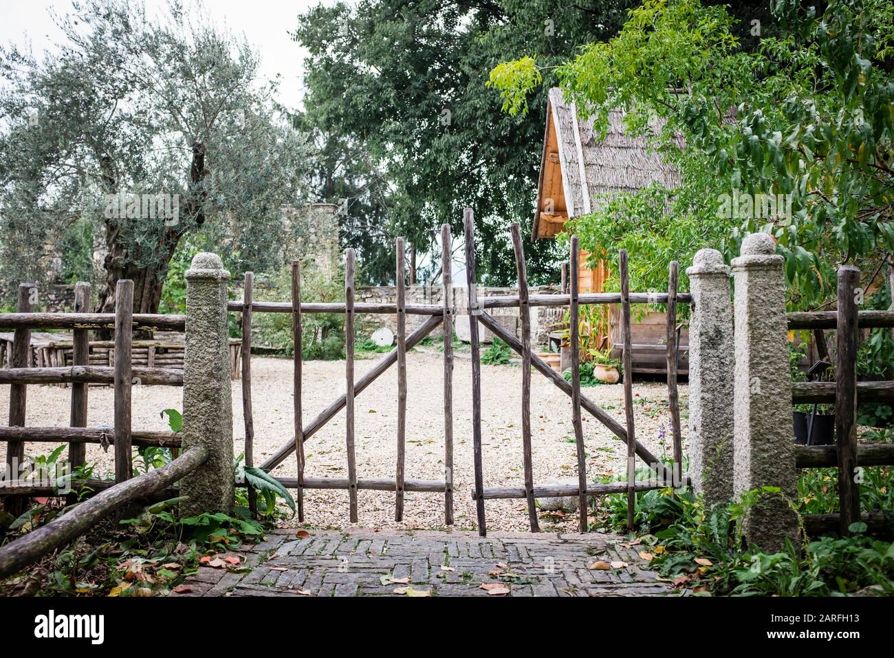 Wooden gate in the garden of a medieval castle, Angera, Italy Stock ...