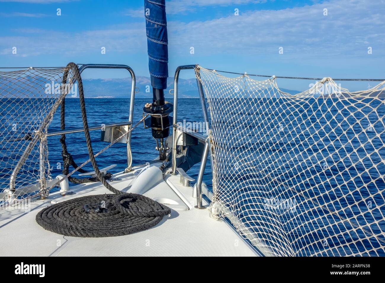 The bow of a sailing yacht at sea. Staysail twist and many ropes Stock ...