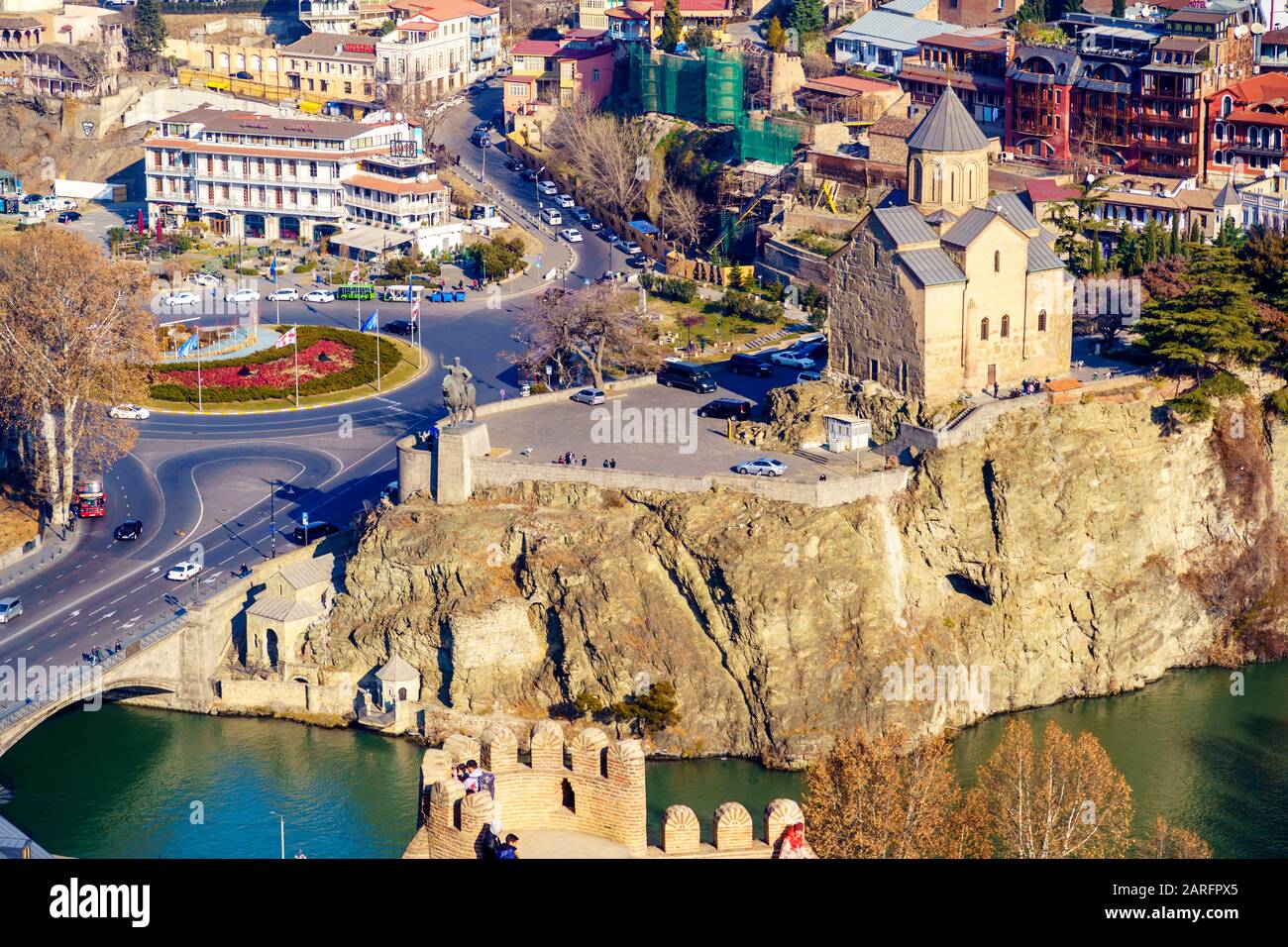 The Metekhi temple, which is picturesquely located on a rock above the ...