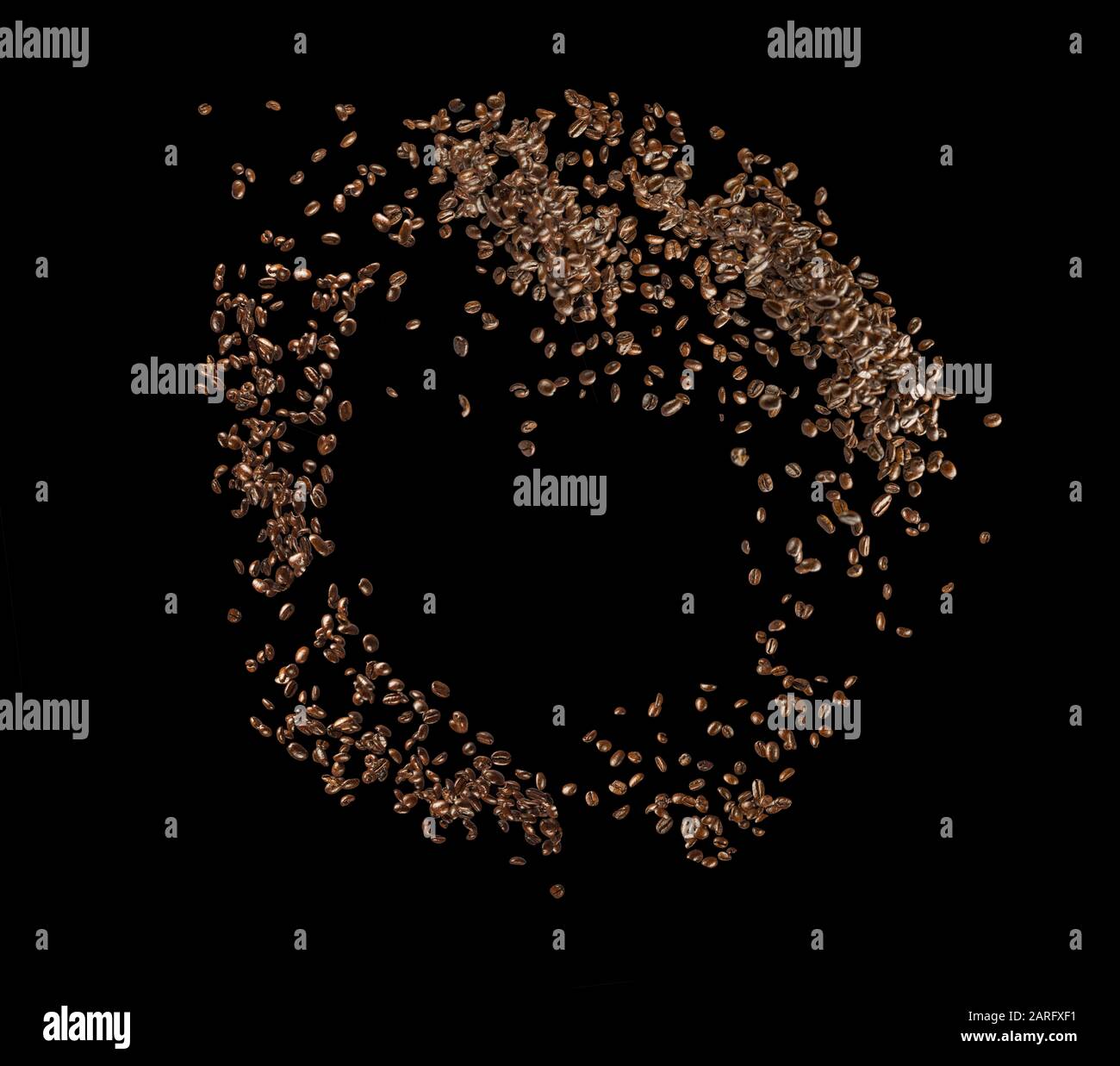 Coffee Beans splashing isolated on black background Stock Photo - Alamy
