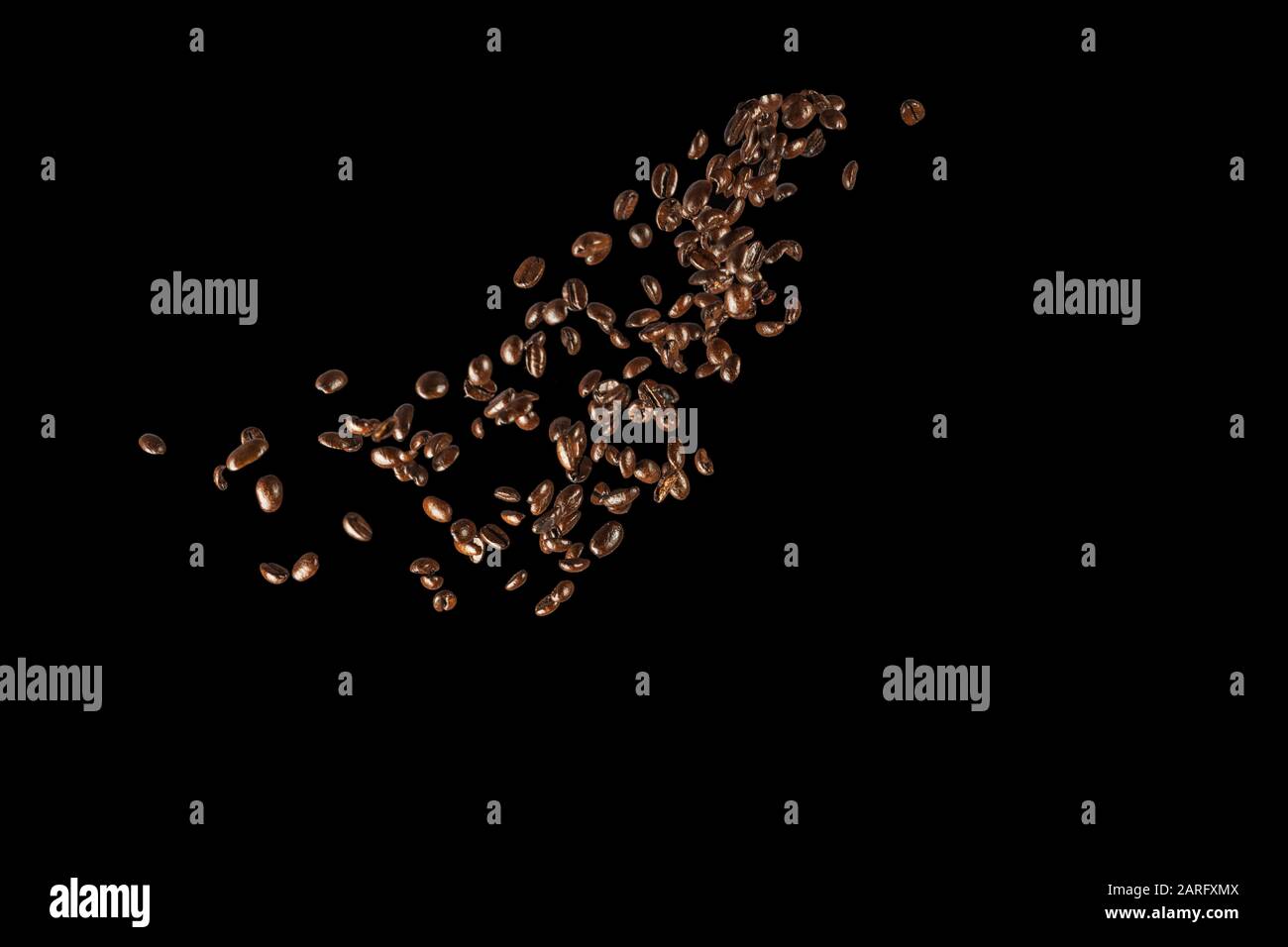 Coffee Beans splashing isolated on black background Stock Photo - Alamy