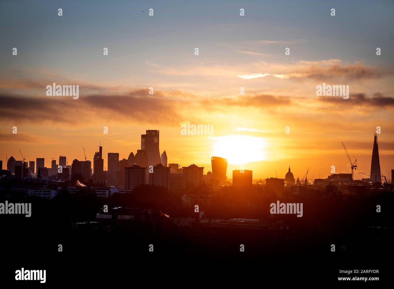 The sun rises over London Stock Photo - Alamy