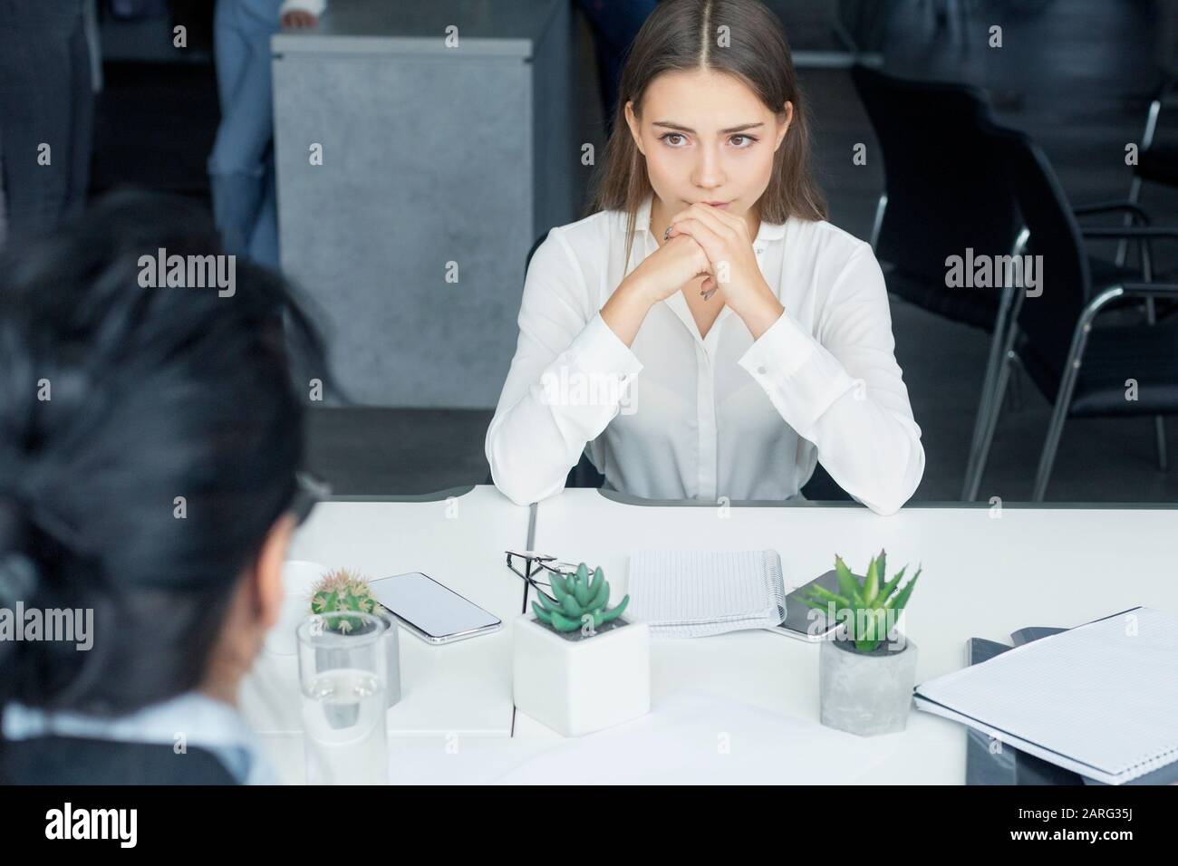 Nervous female applicant waiting for result at job interview Stock ...