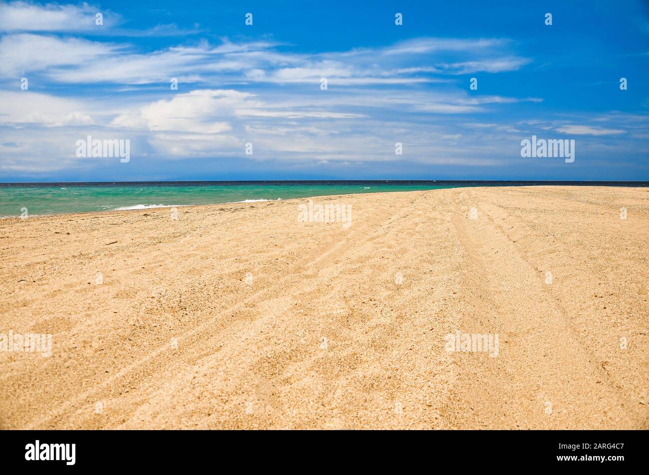 Sandy beach on the azure sea coast Stock Photo - Alamy