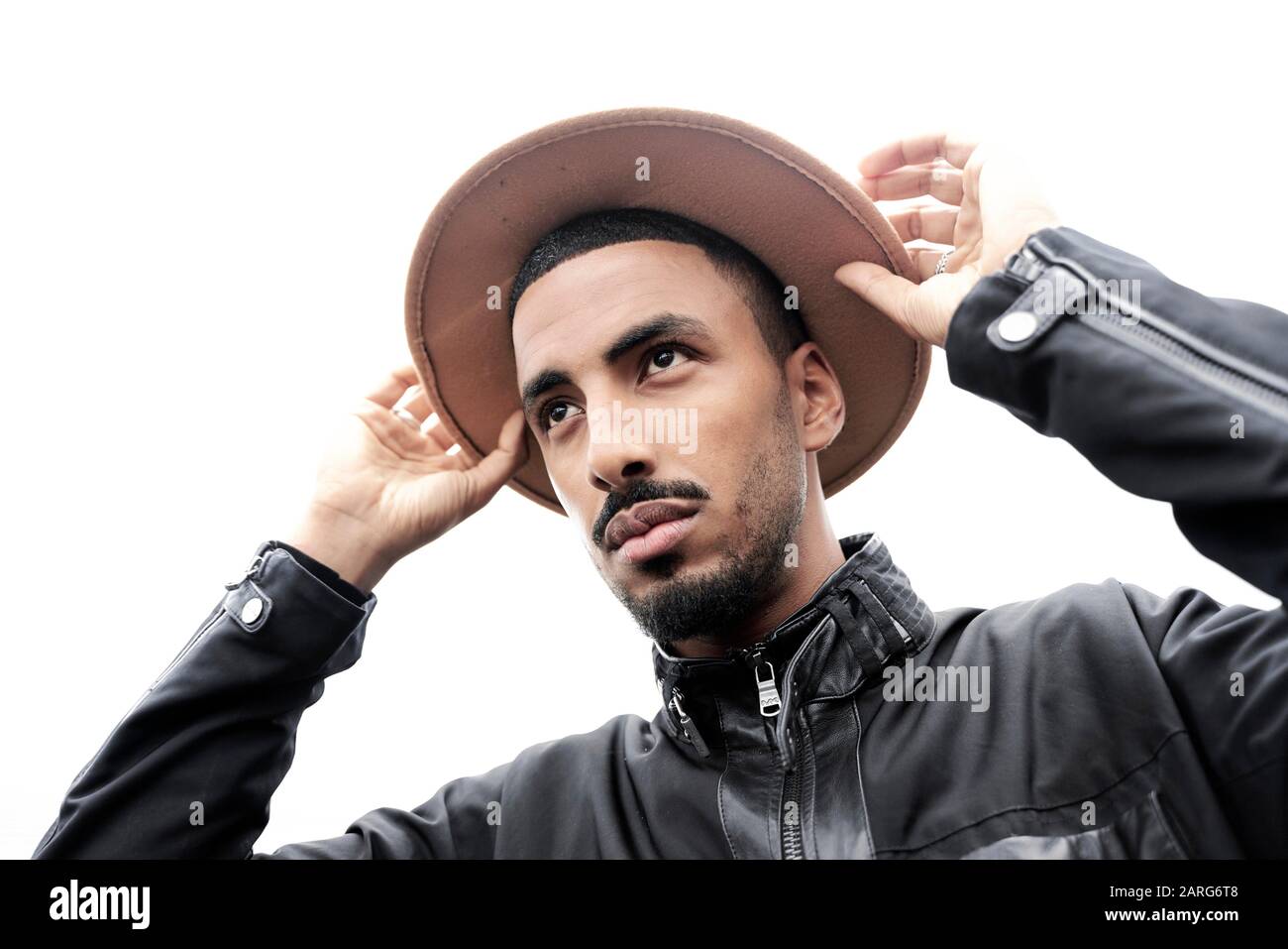 Adjusting headgear hi-res stock photography and images - Alamy