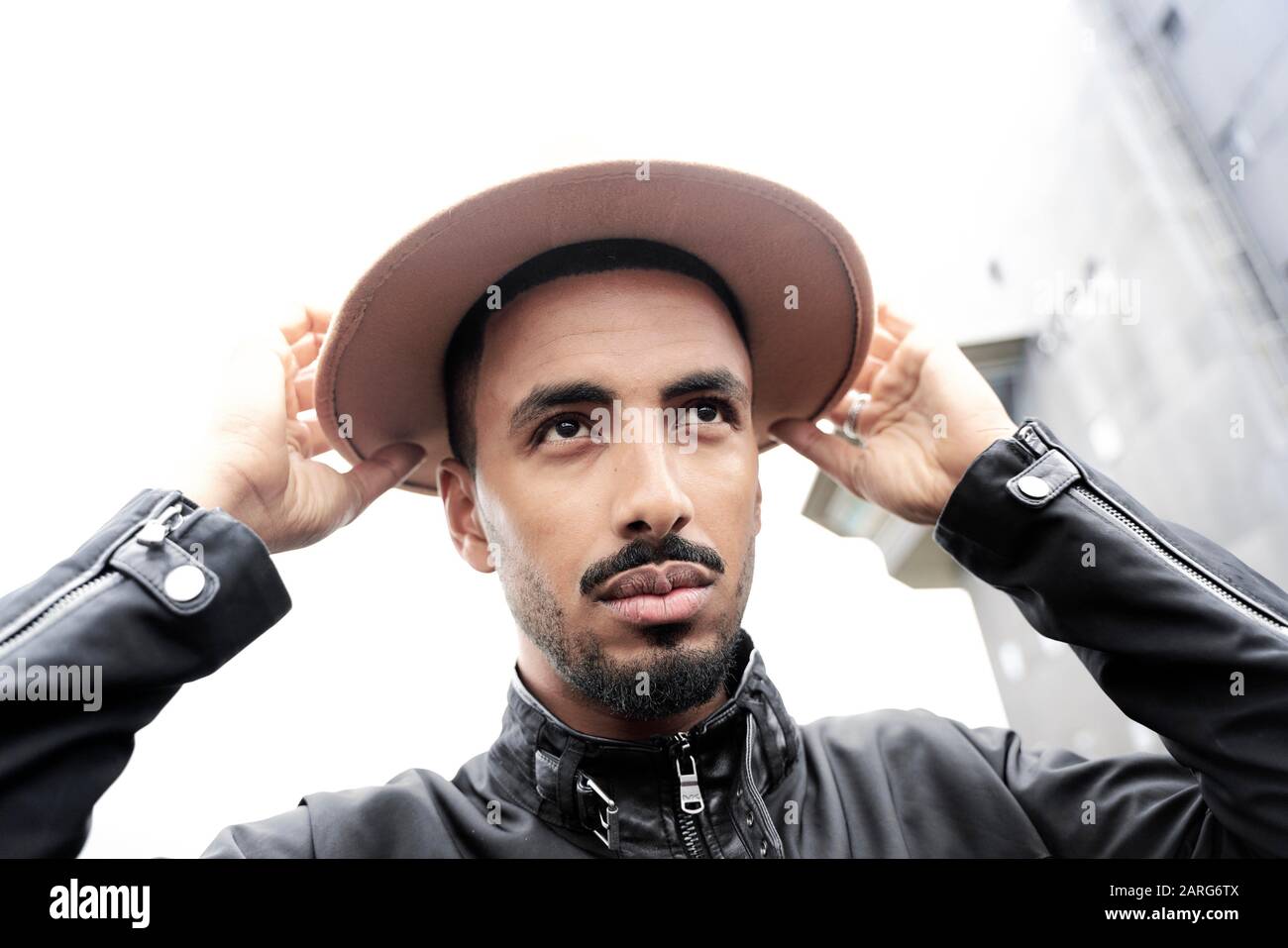 Adjusting headgear hi-res stock photography and images - Alamy