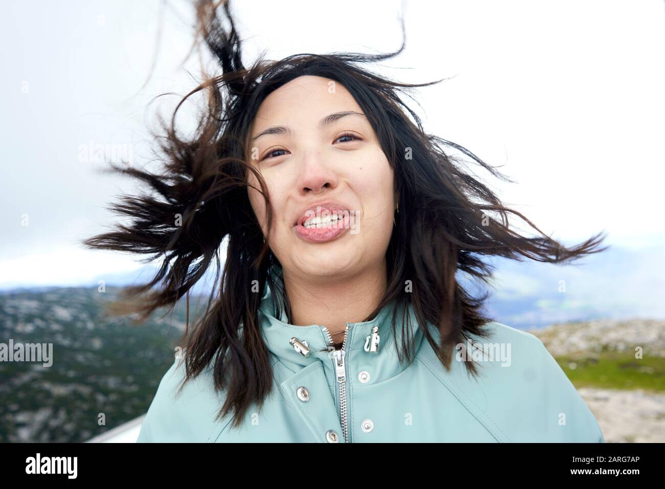 Windswept dark hair hi-res stock photography and images - Alamy