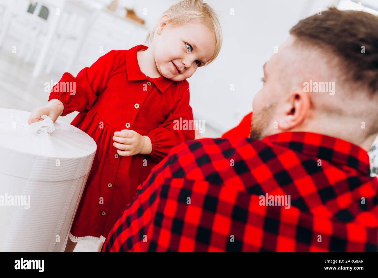 Father and daughter. The best father. Dad gives his daughter a present ...