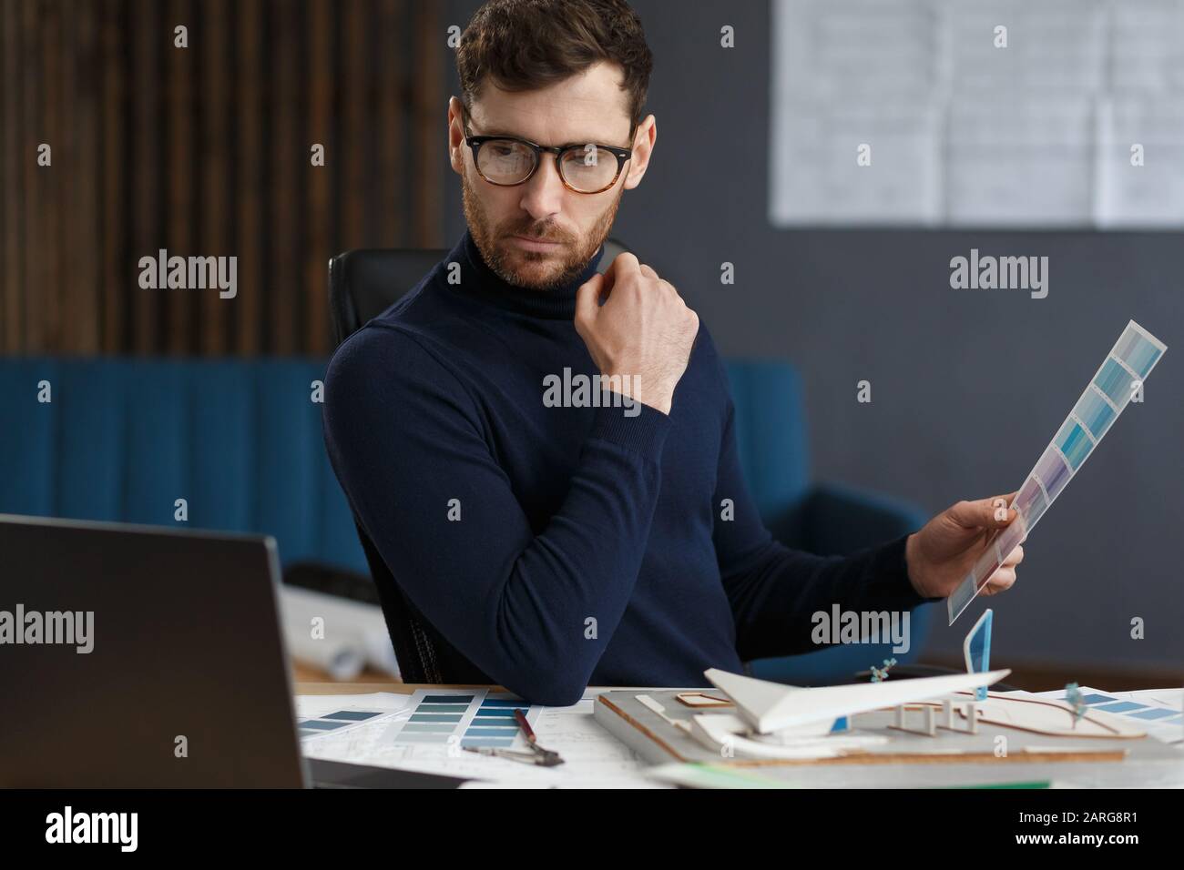 Architect working in office with color palette. Engineer select colors ...
