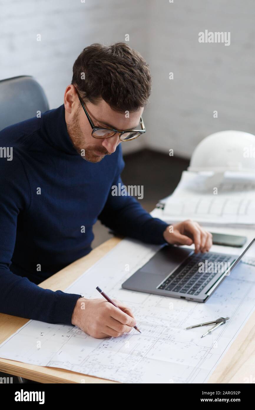 Architect Working In Office With Blueprintsengineer Inspect Architectural Plan Sketching A