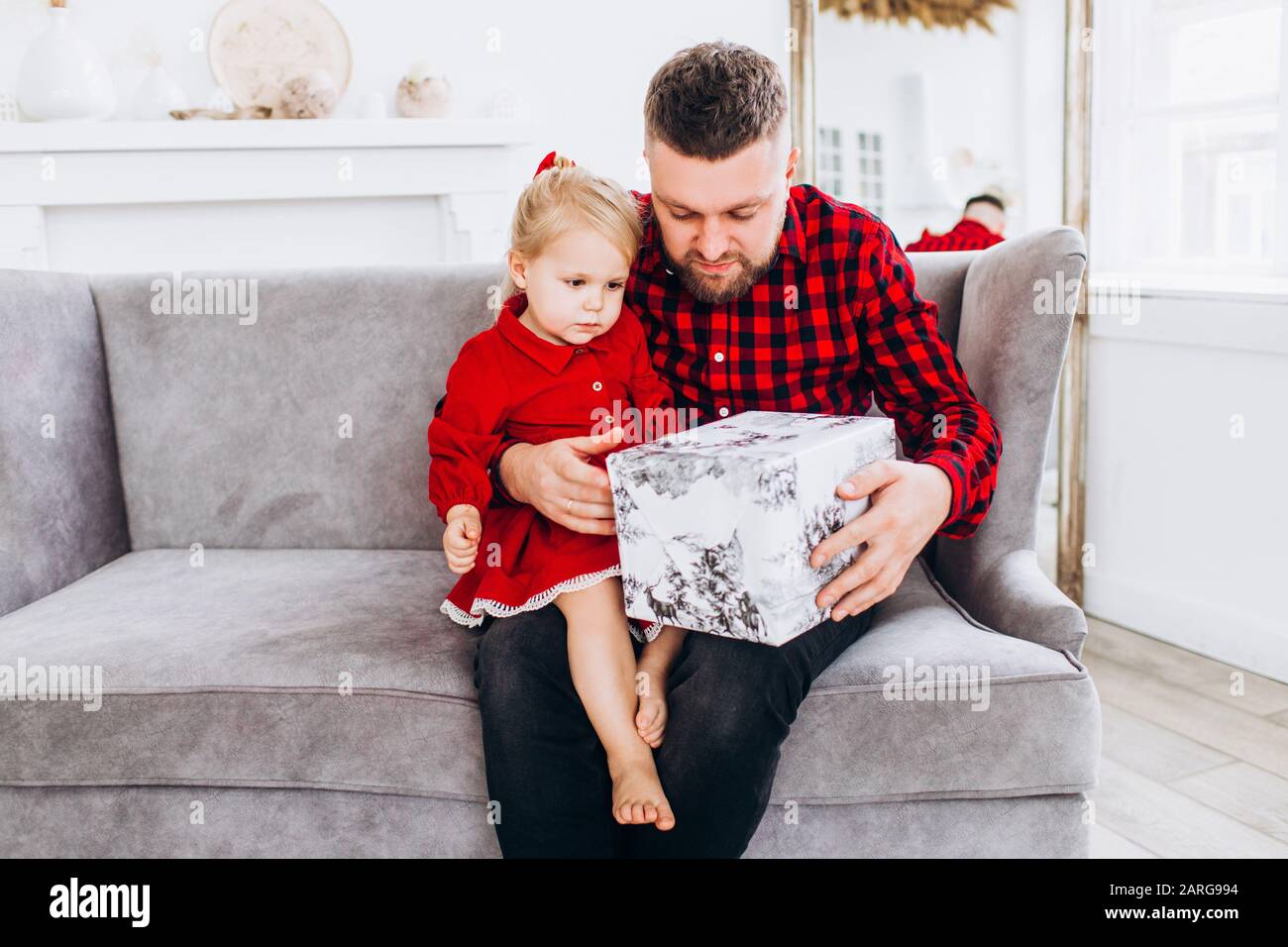 Father and daughter. The best father. Dad gives his daughter a present ...