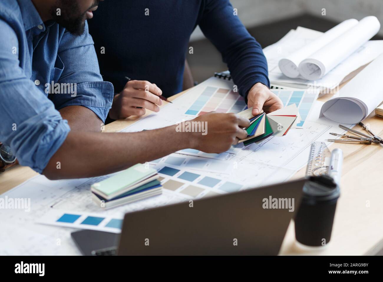 Multiracial engineer team working in office with color palette ...