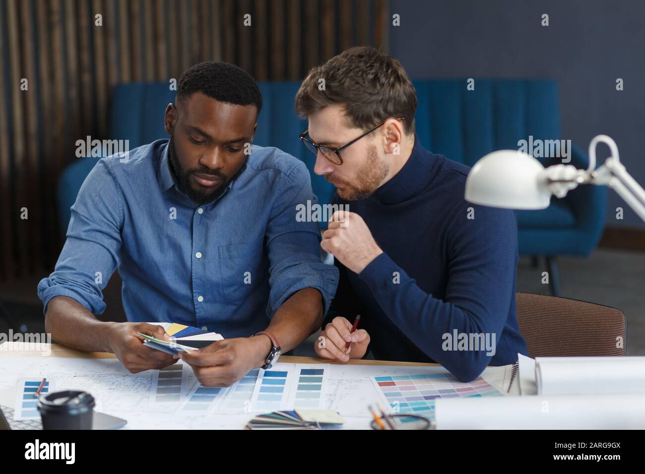 Multiracial engineer team working in office with color palette ...