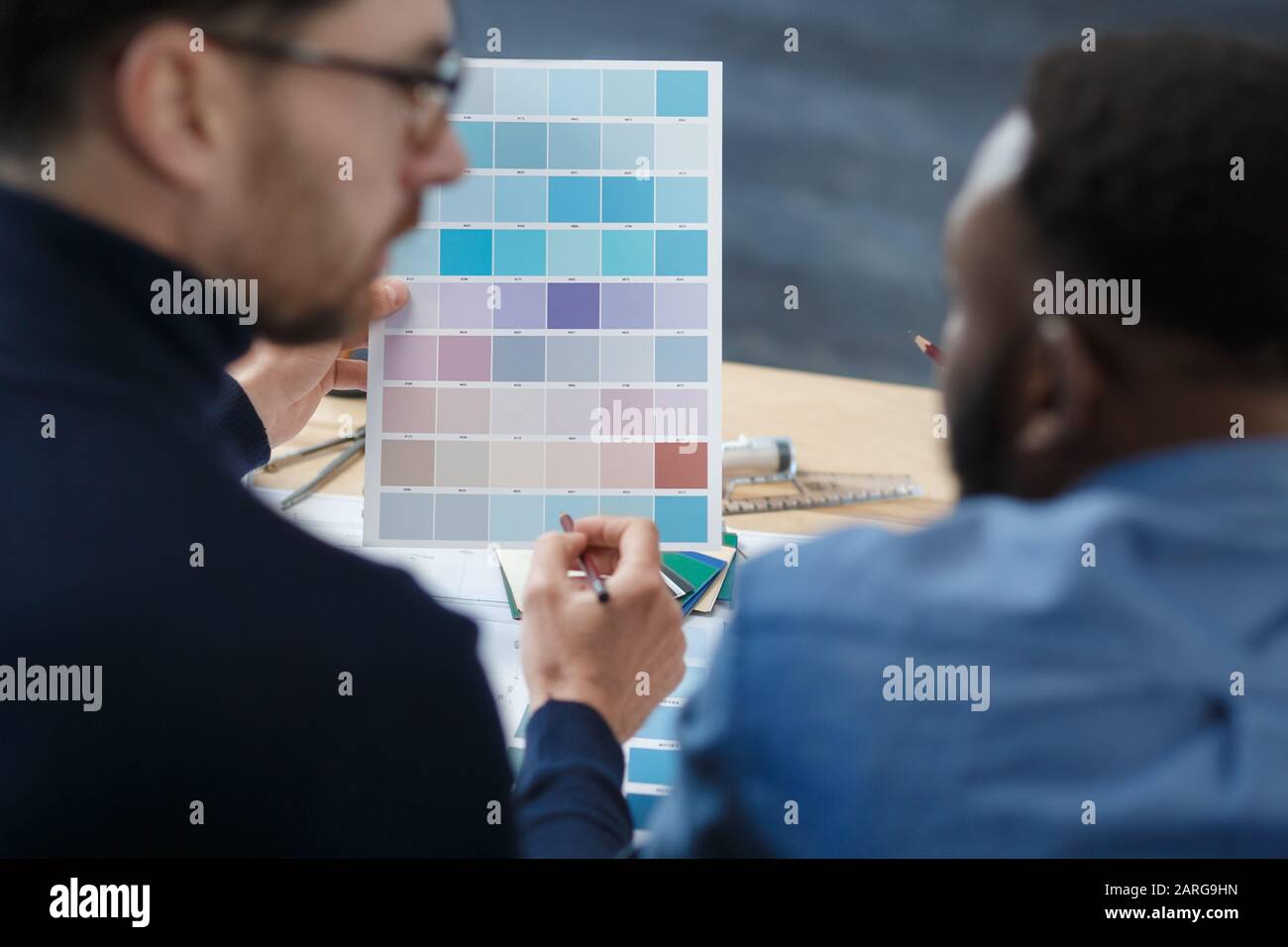 Multiracial engineer team working in office with color palette ...