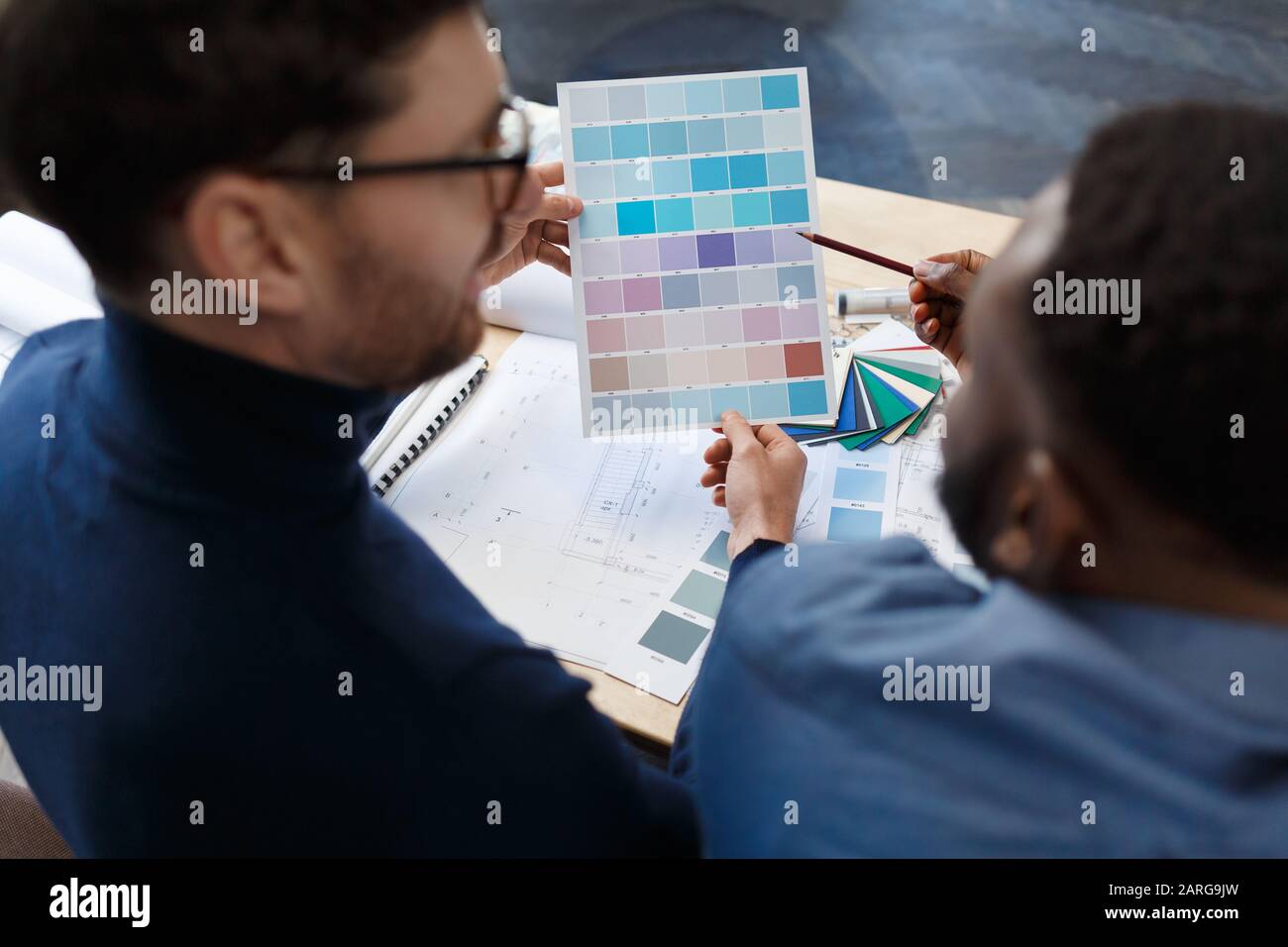 Multiracial engineer team working in office with color palette ...