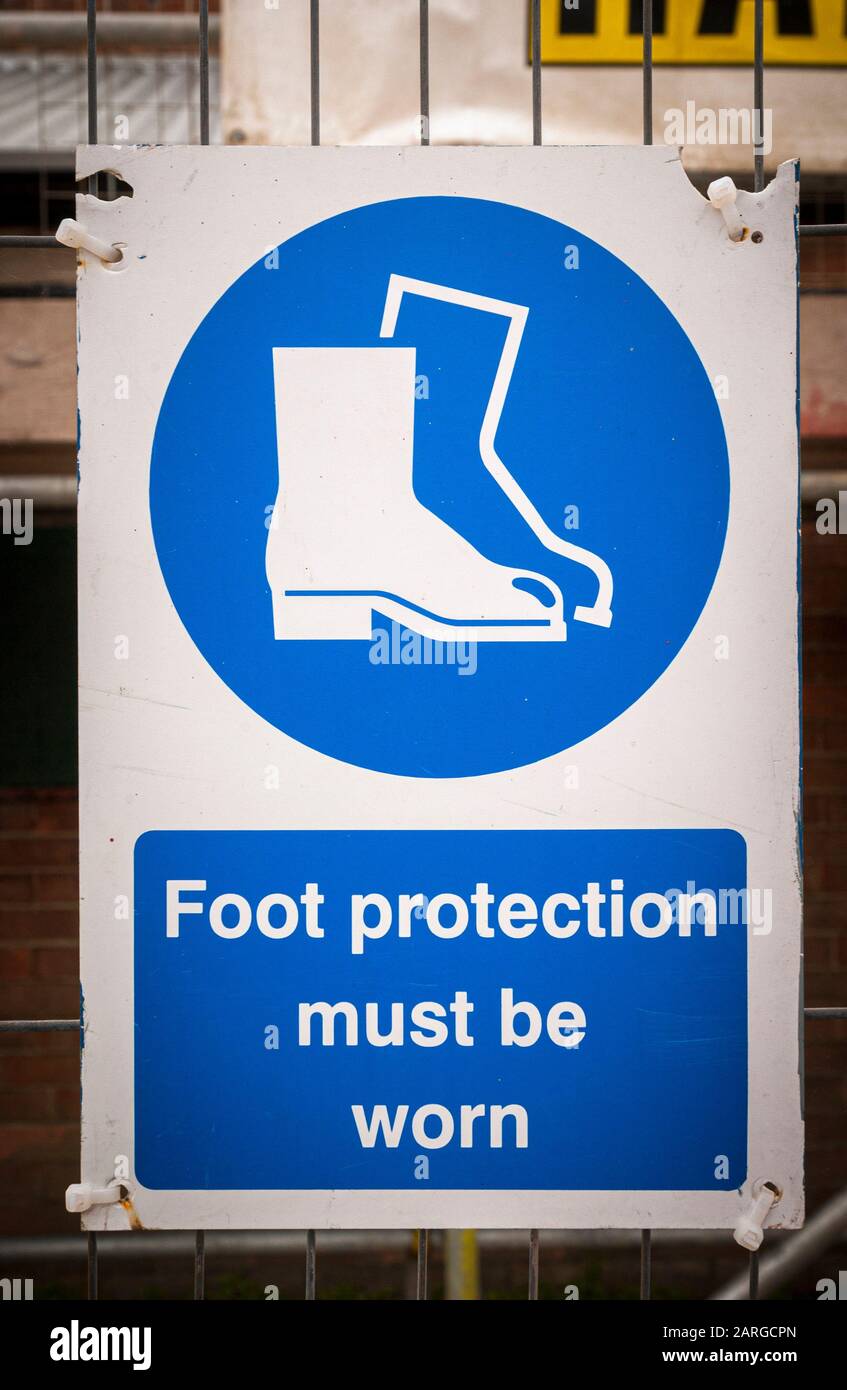 Foot Protection Must Be Worn sign on construction site Stock Photo - Alamy