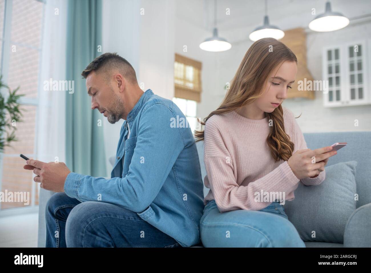 Two people turning backs on each other hi-res stock photography and ...
