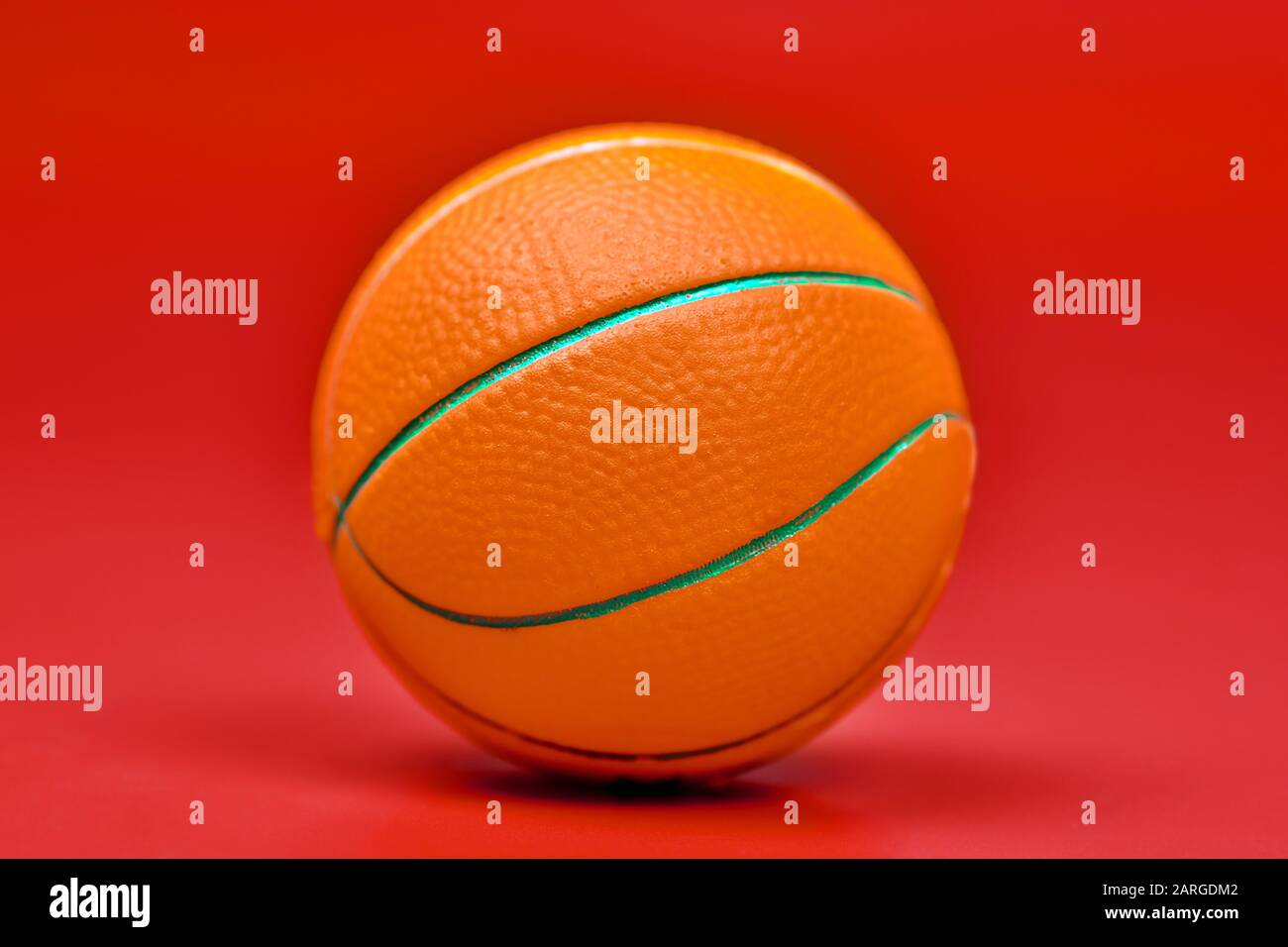 Basketball ball, red background. Spherical ball used in basketball ...