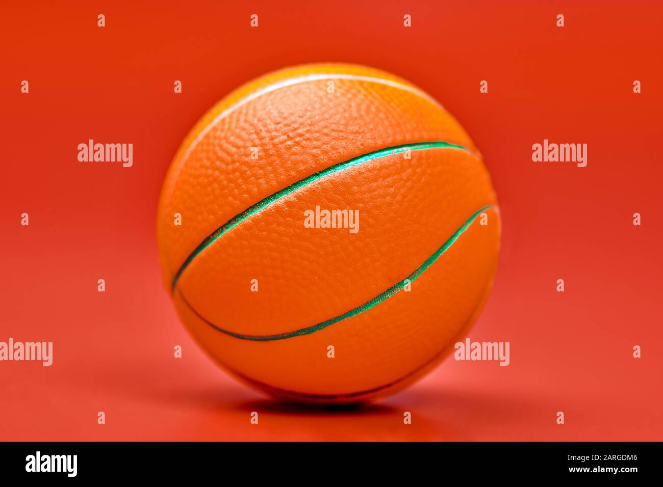Basketball ball, red background. Spherical ball used in basketball ...