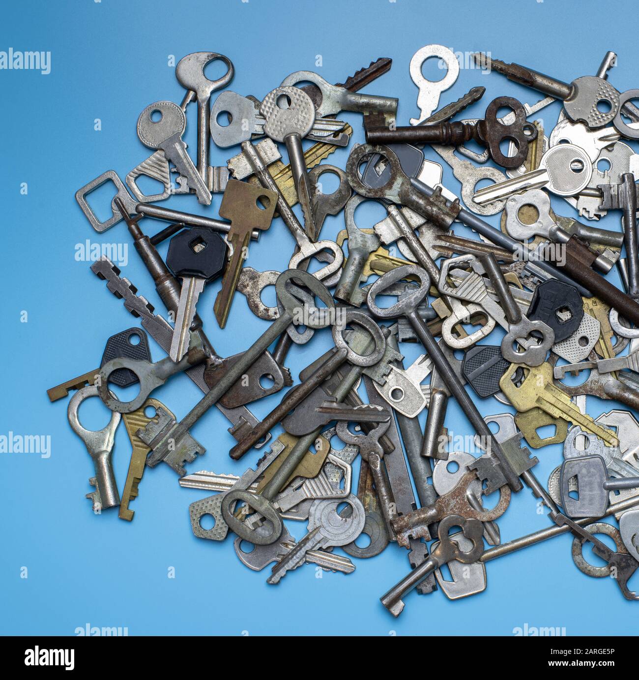 Keys set on blue background. Door lock keys and safes for property ...