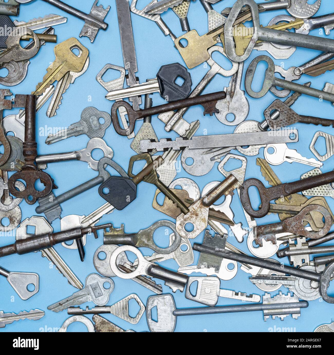 Keys set on blue background. Door lock keys and safes for property ...