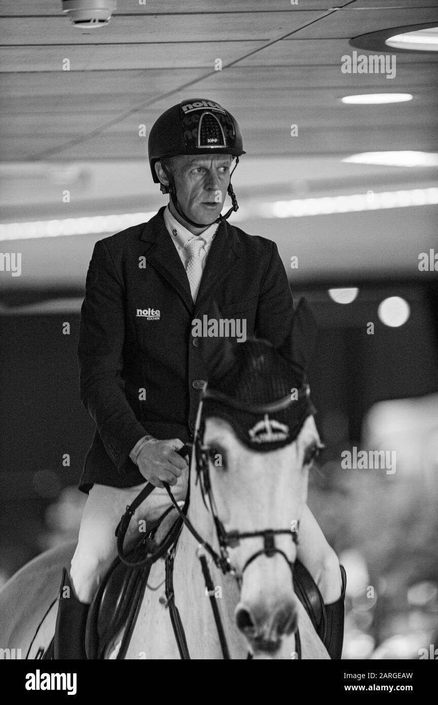 AMSTERDAM, NETHERLANDS - JANUARY 26: Marcus Ehning of Germany riding ...