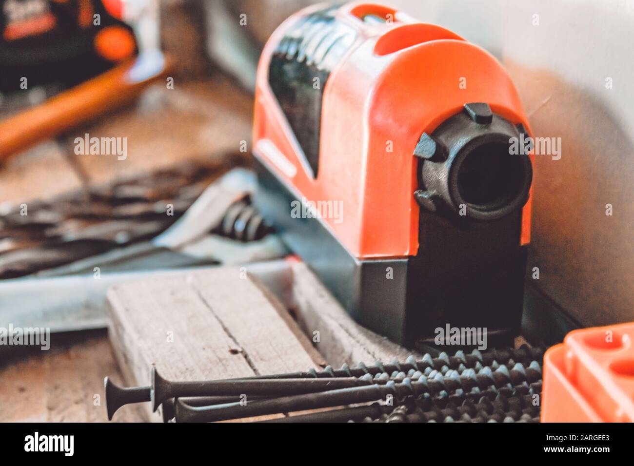 Tools for working with a wrench, a screwdriver and a drill are lying on ...