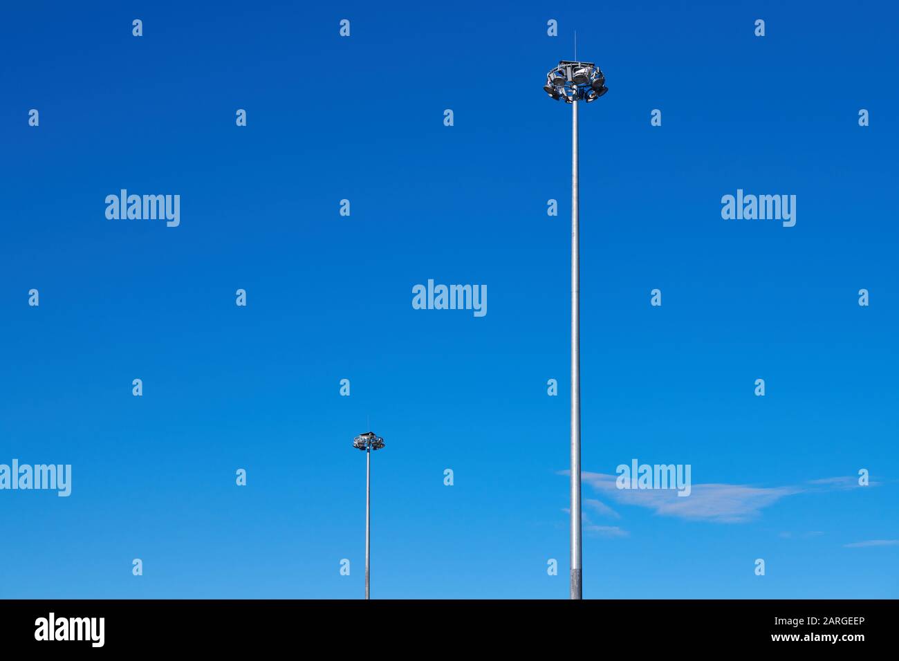Light poles, copy space. LED light post for parking lot, blue sky ...