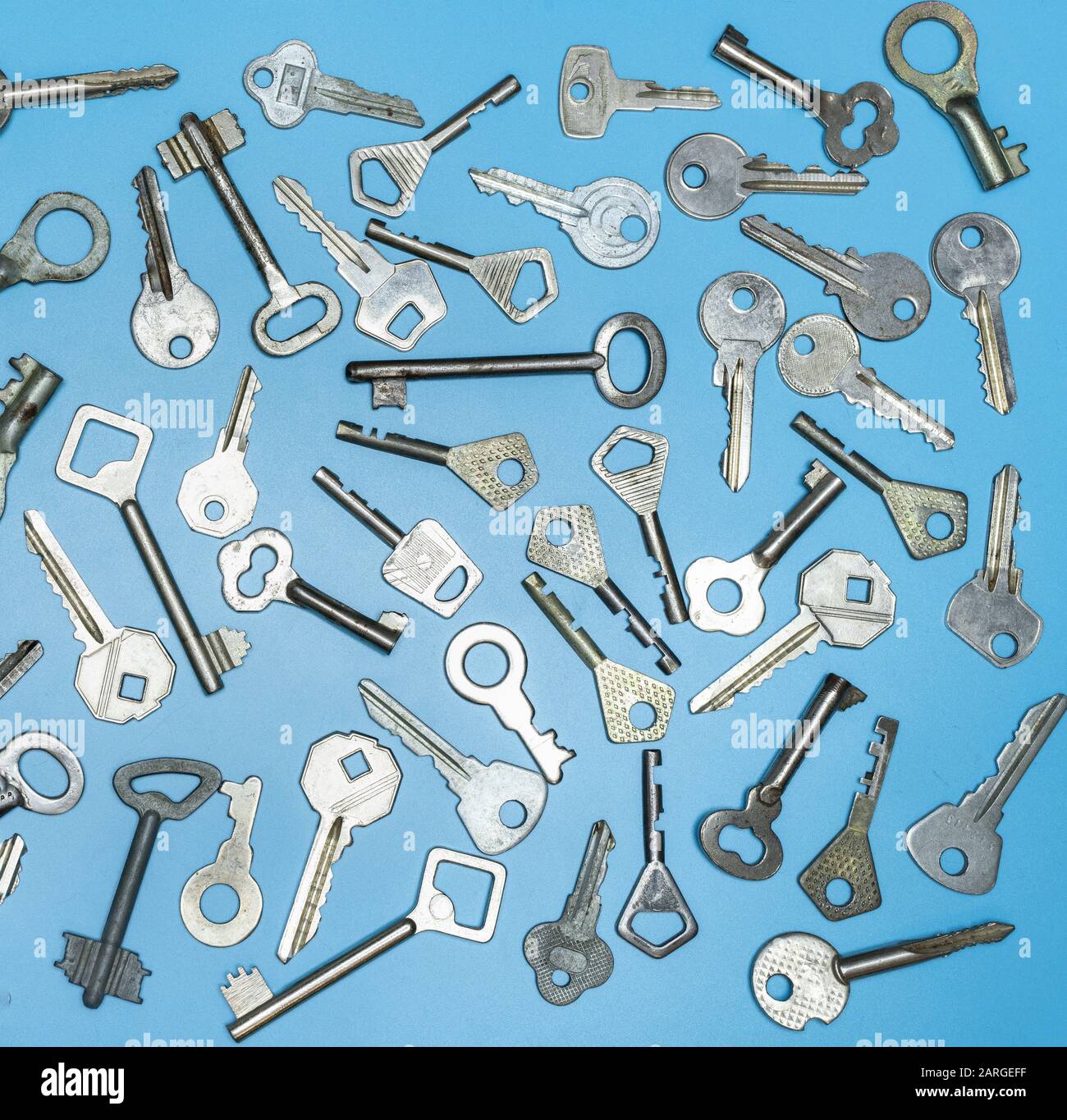 Keys set on blue background. Door lock keys and safes for property ...
