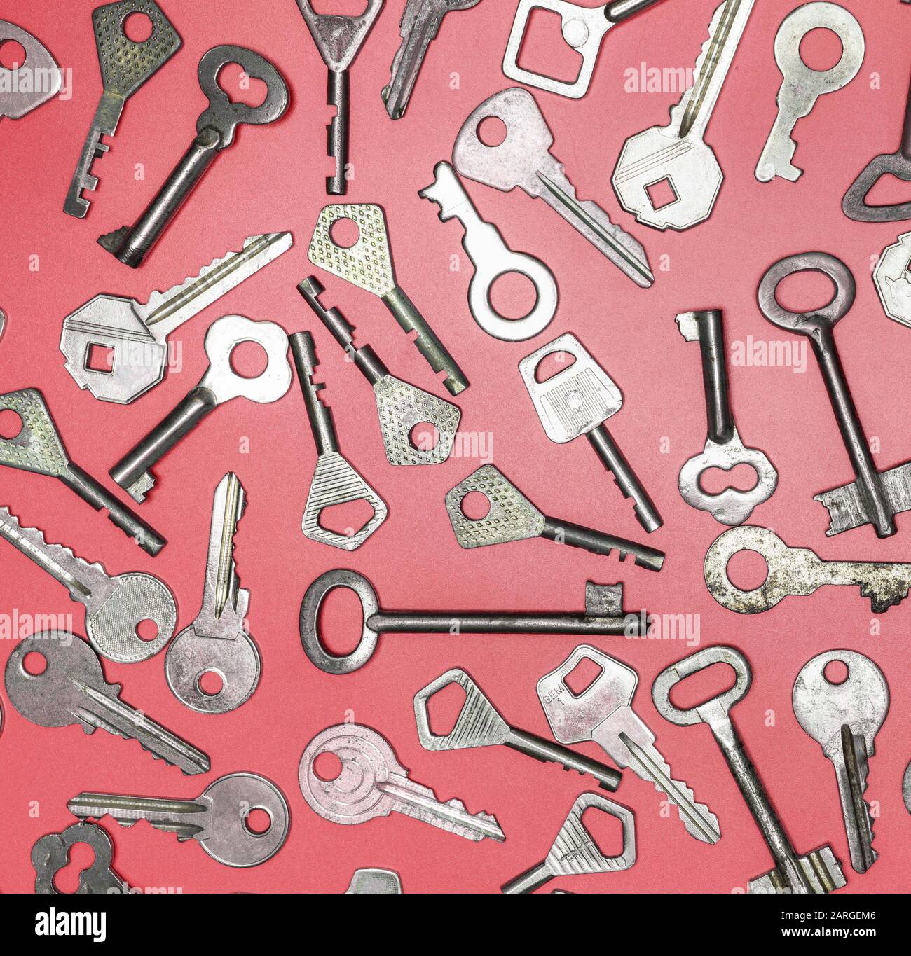 Keys set on pink background. Door lock keys and safes for property ...