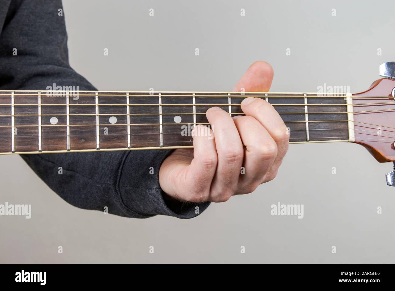 Hands Playing Acoustic Guitar