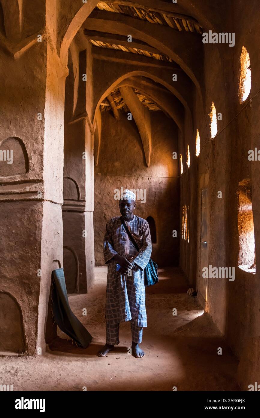 Imam praying in a beautiful Hausa style architecture Mosque in Yaama ...