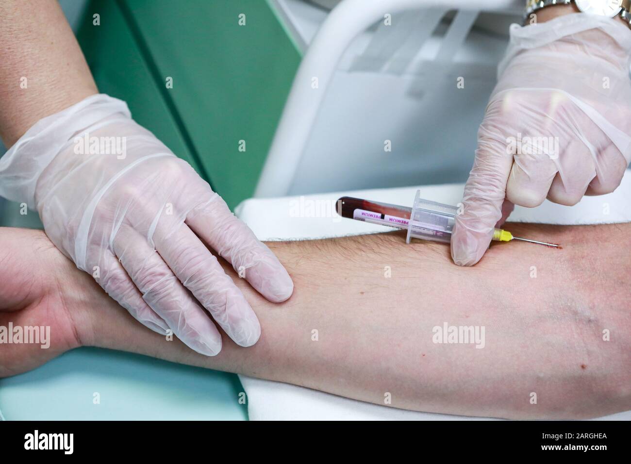 A blood donor sits on the chair to donate blood in the Hospital of St ...