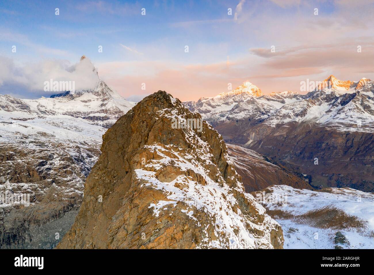 Aerial view of Riffelhorn ridge, Matterhorn and Dent Blanche at sunrise ...