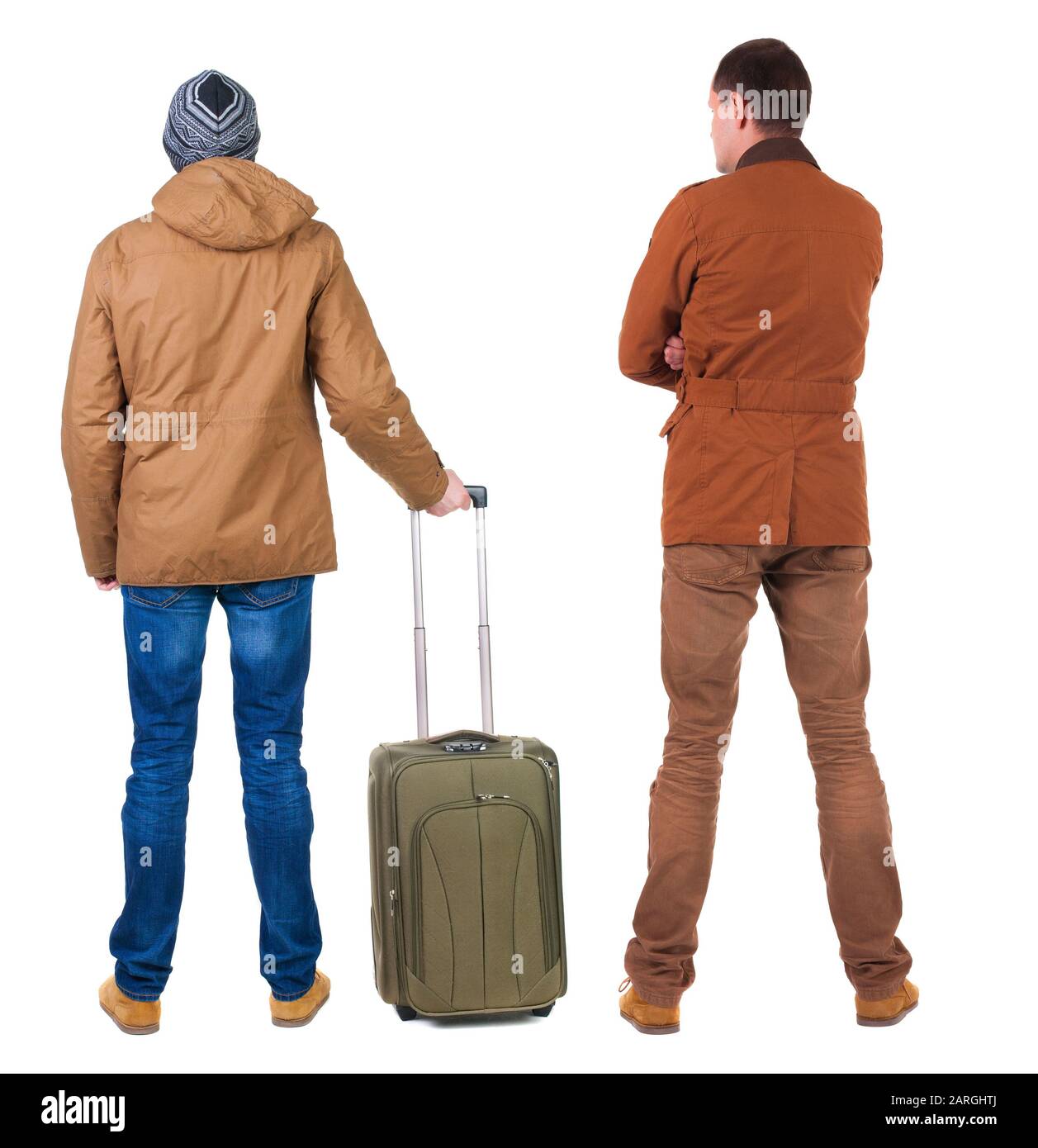 Back view of two man in winter jacket traveling with suitcas. Back view ...