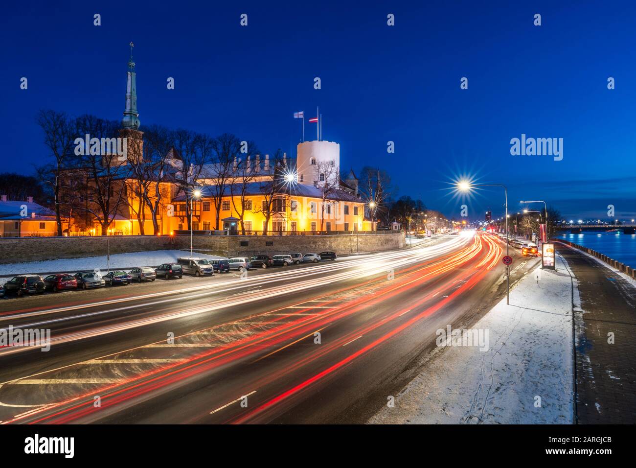 Riga's skyline and President Castle at night in winter, Old Town ...