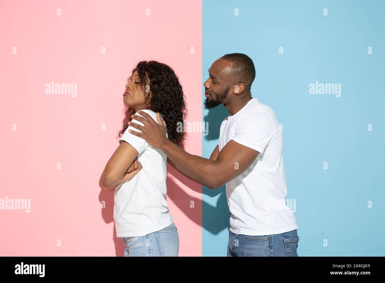 Man apologizing. Young emotional man and woman in casual clothes on ...