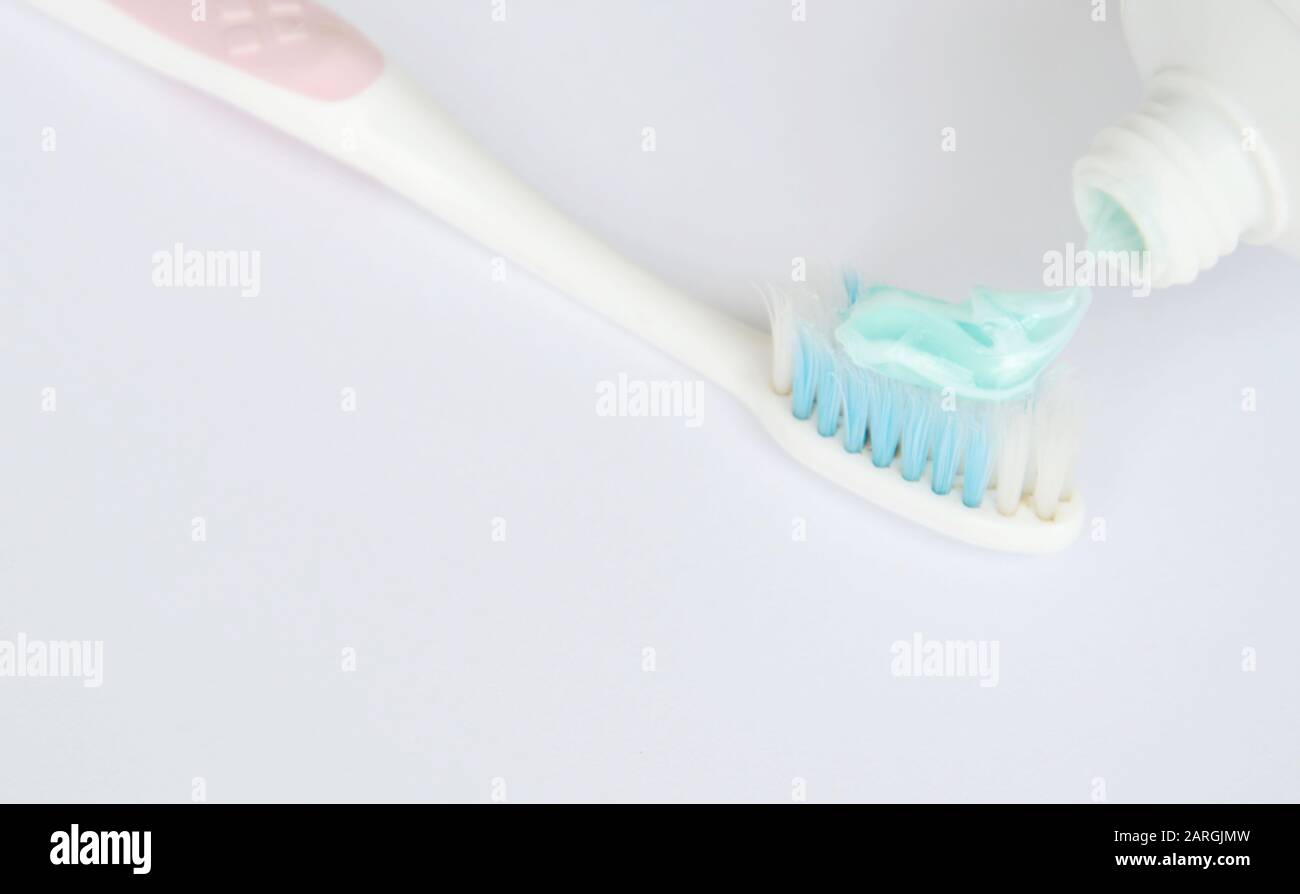 squeeze toothpaste put on toothbrush in white background Stock Photo ...