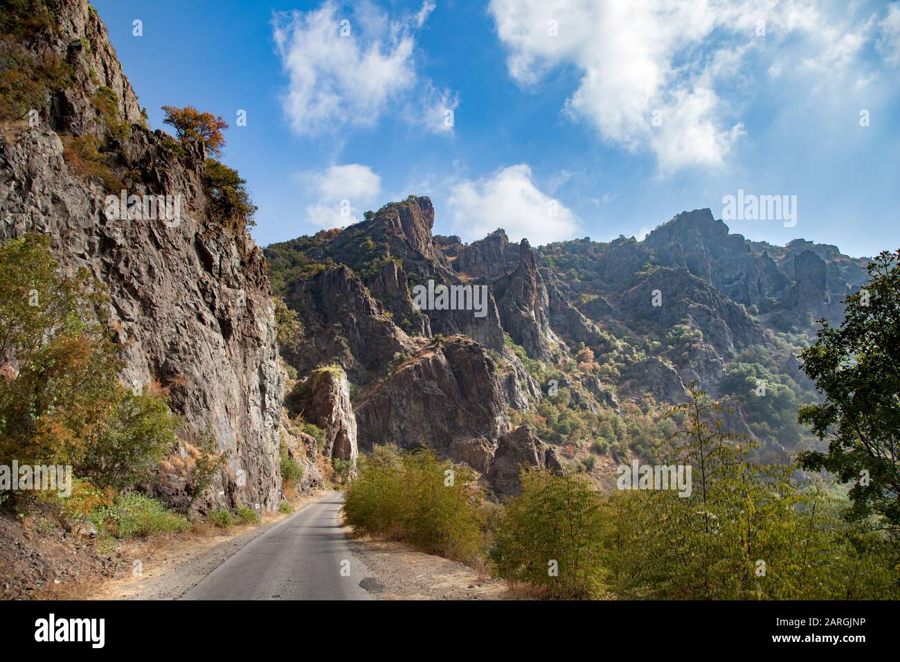 Mountain landscape with high cliffs rocks and narrow mountain road in a ...