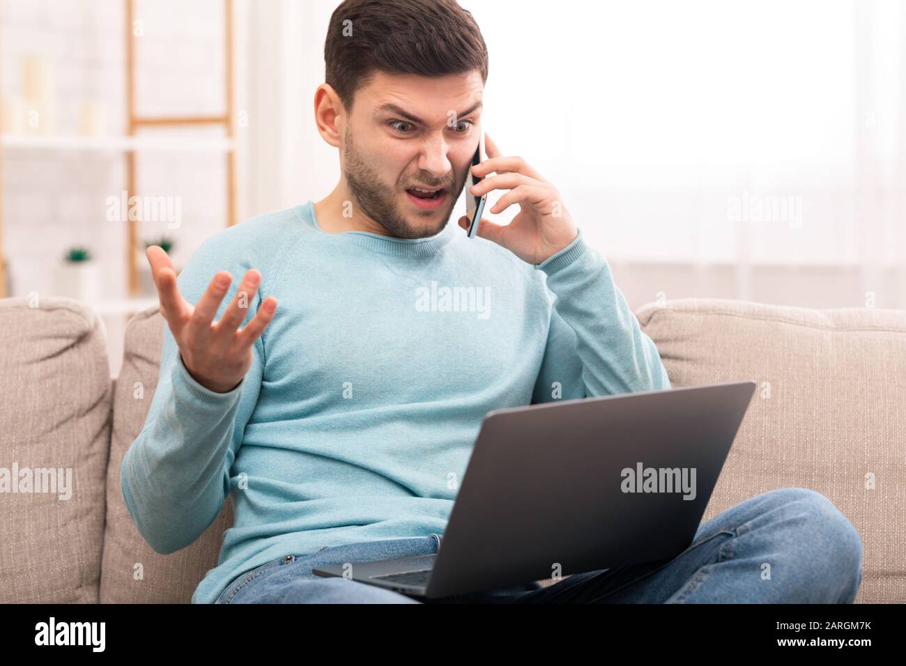 Angry man laptop talking on hi-res stock photography and images - Alamy