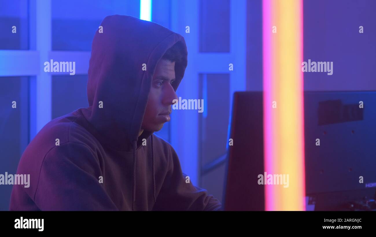 Close-up of multinational hacker penetrating network system. He working ...