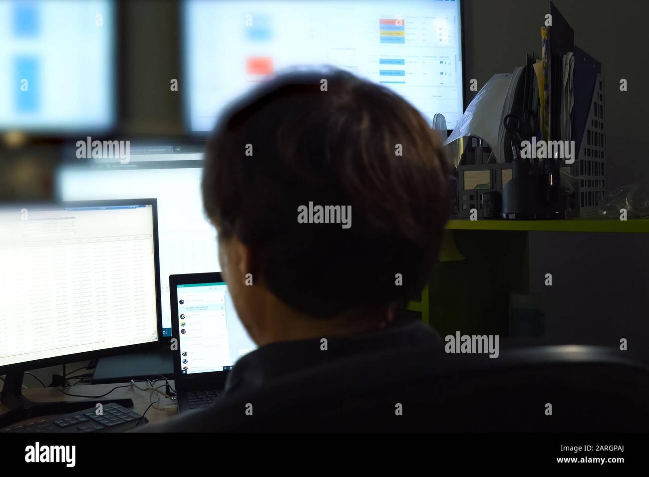 Hacker behind computer hi-res stock photography and images - Alamy